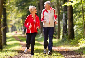 Over 50s Couple Jogging in Forest | Anne Davidson Fitness